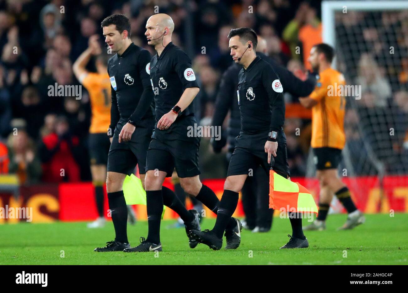 Referee Anthony Taylor (centre) leaves the pitch at the end of the ...