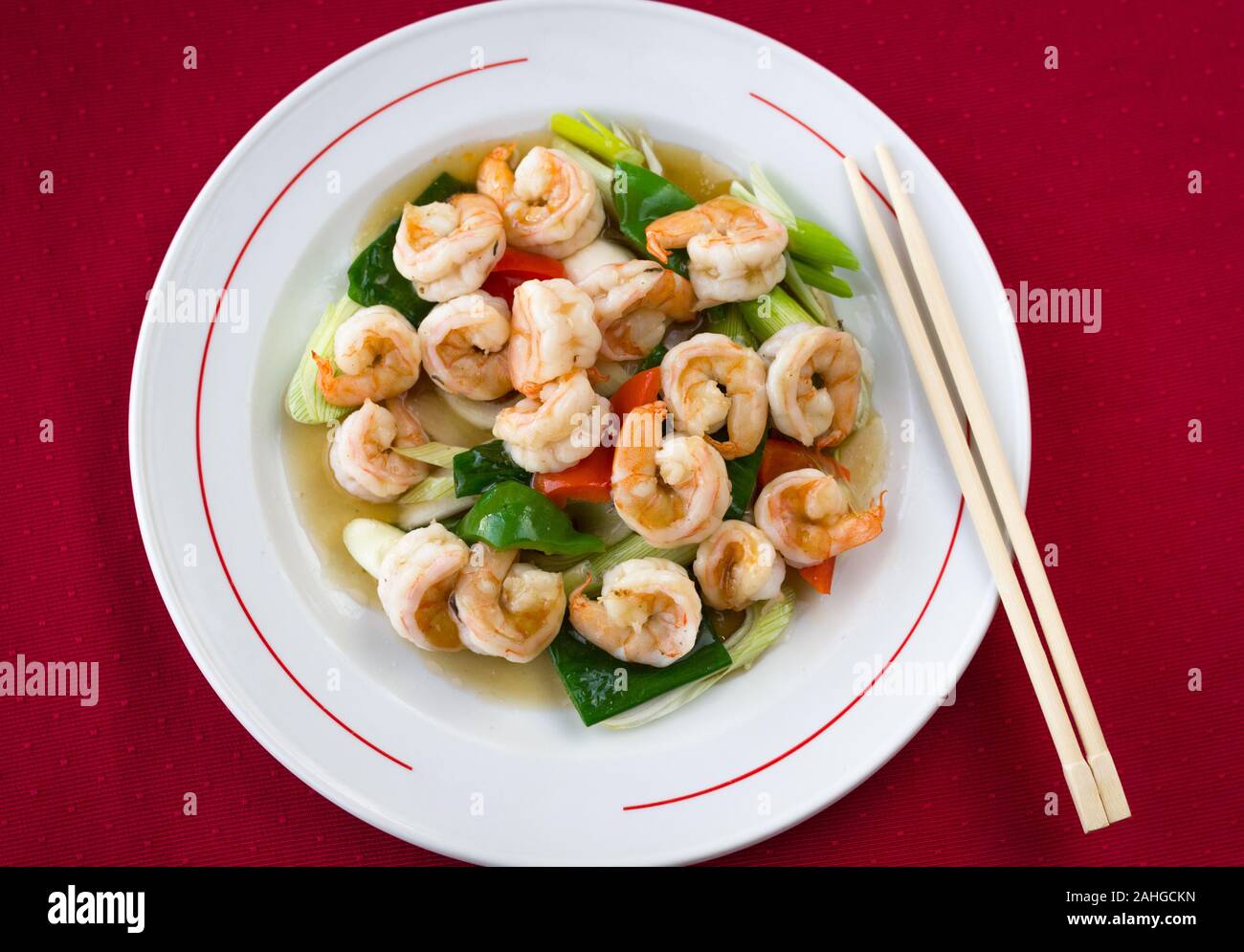 Delicious plate of king prawns with green and red bell peppers, onion ...