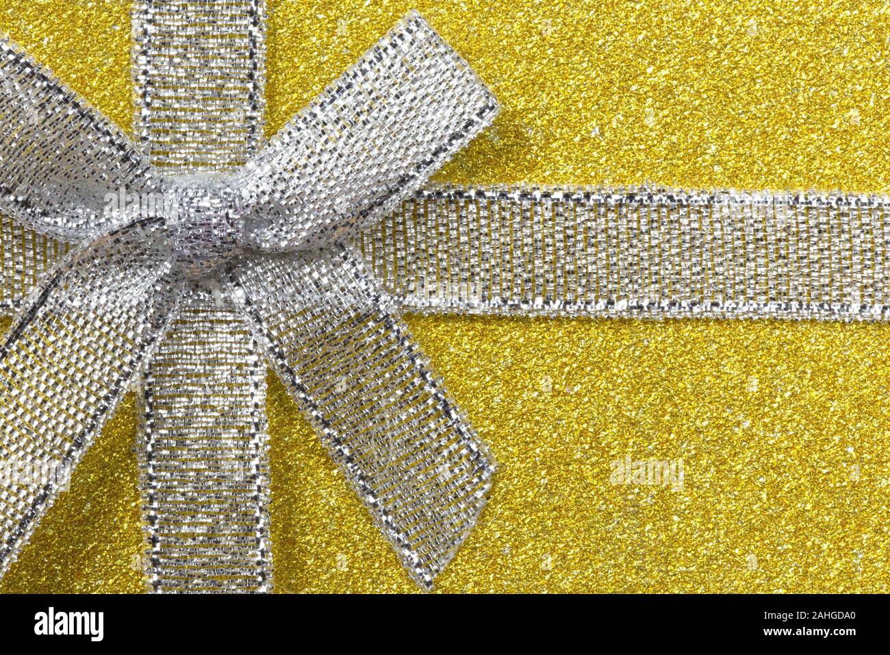 Sparkling gift box or present with bow ribbon on magic Background with ...