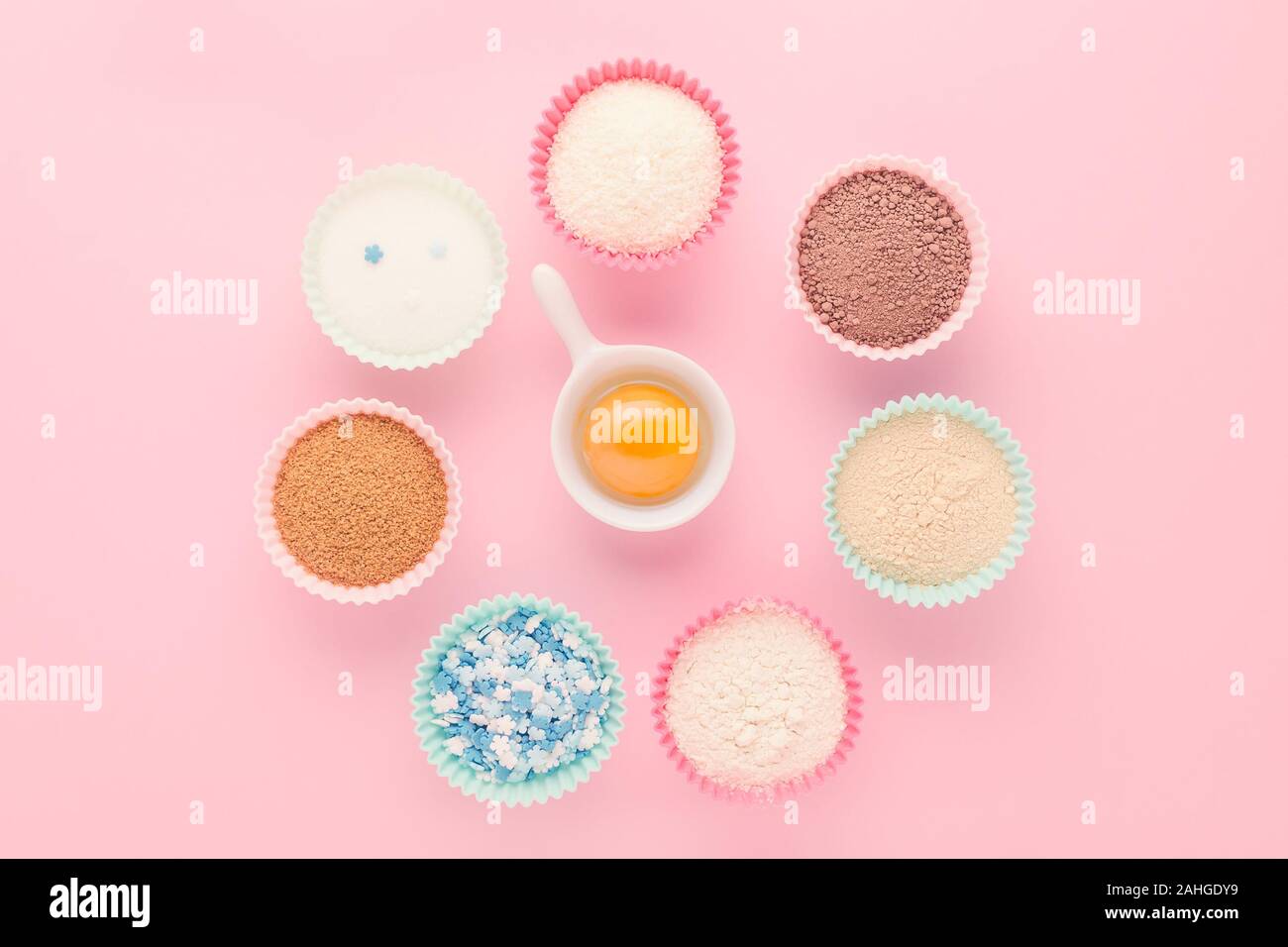 ingredients like a clock, baking time concept, on pink background Stock ...