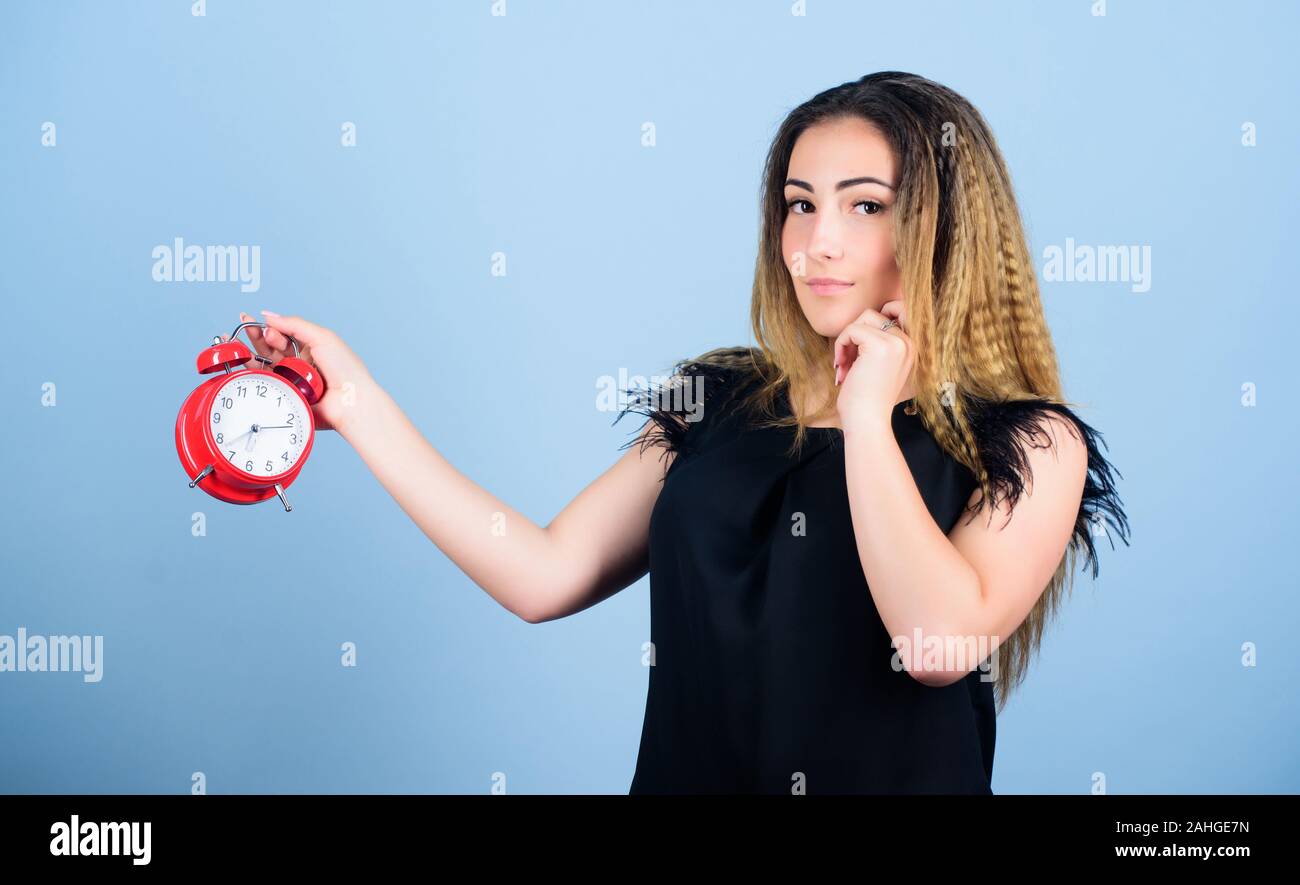 Time management. Punctuality and discipline. Woman hold red alarm clock ...