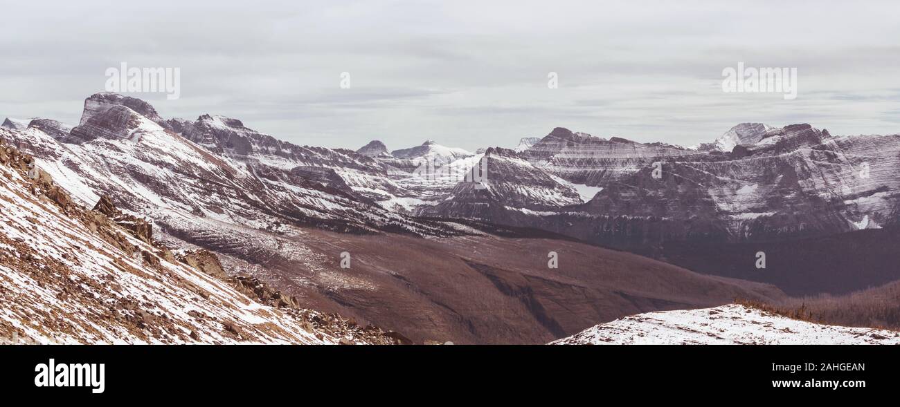 Early winter with first snow covering rocks and woods in the Glacier ...