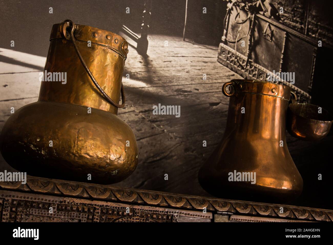 Two old copper pots in angle perspective. Medieval museum pieces Stock ...