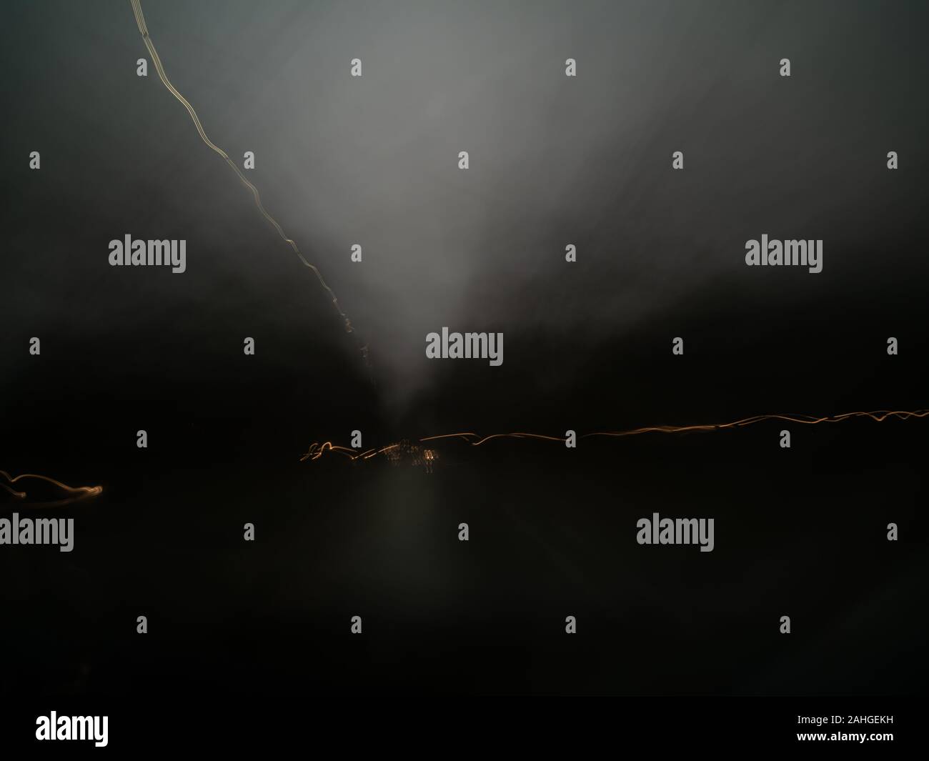 Odd Streaks From Lights on a Road at Dusk Stock Photo - Alamy
