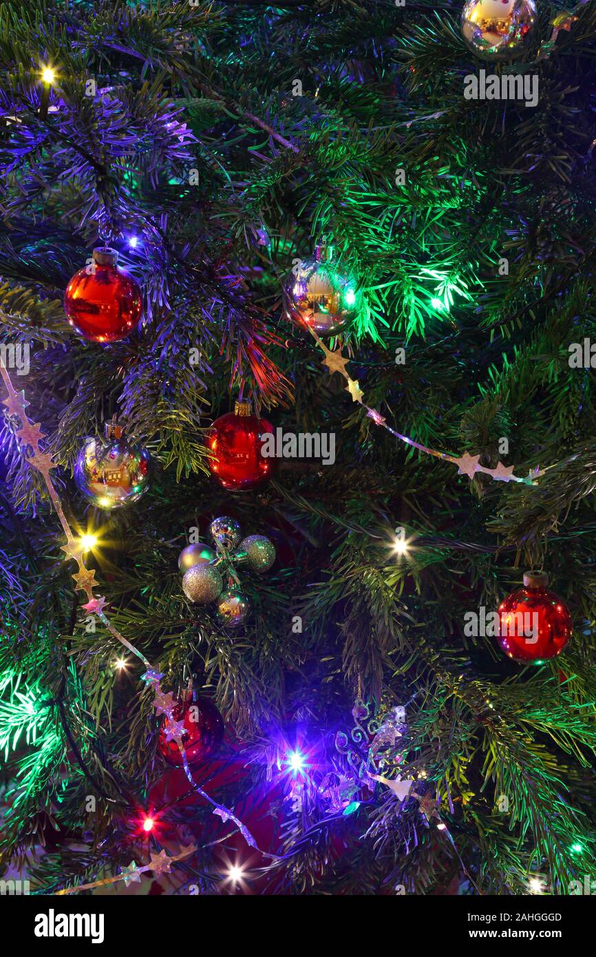 Silver tinsel christmas tree hi-res stock photography and images - Alamy