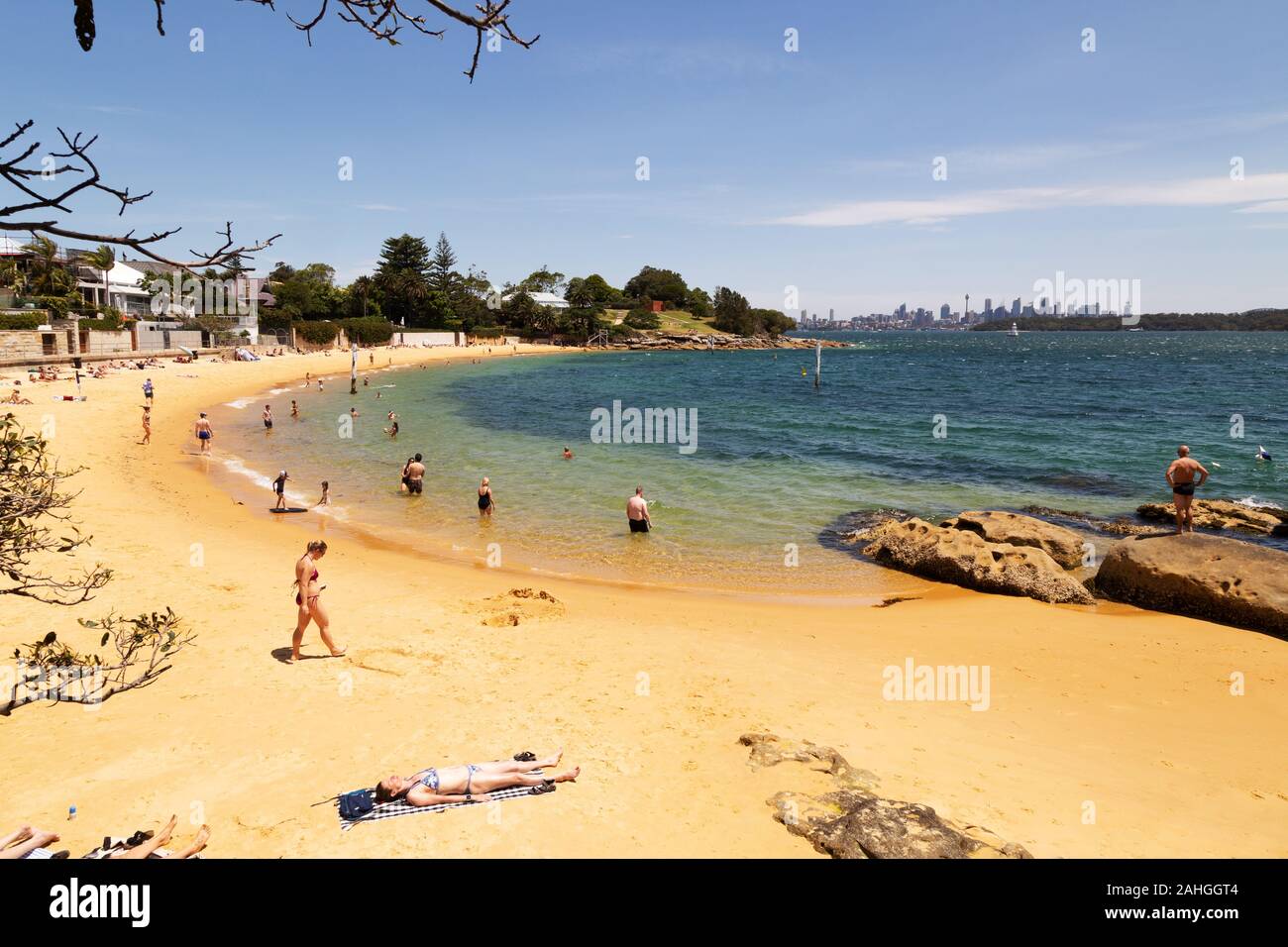 Australia beach; People sunbathing on the golden sand of Camp Cove ...