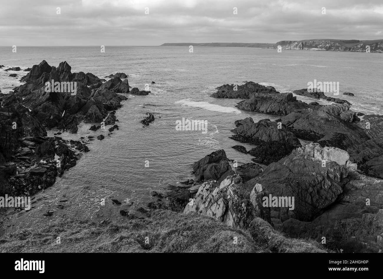 The rugged rocks surrounding Burgh Island off Bigbury on Sea, looking ...