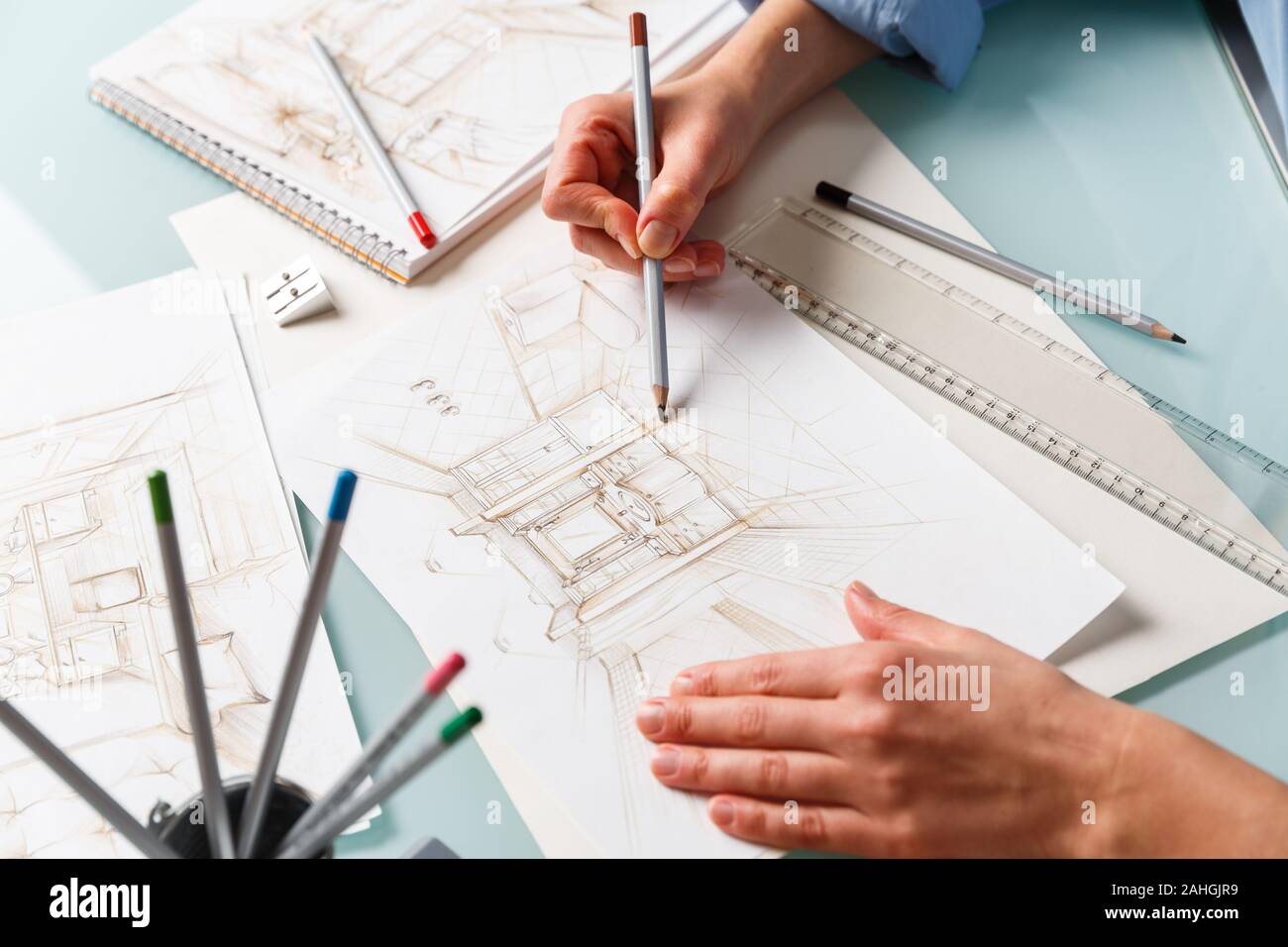 Interior designer making hand drawing pencil sketch of a bathroom ...