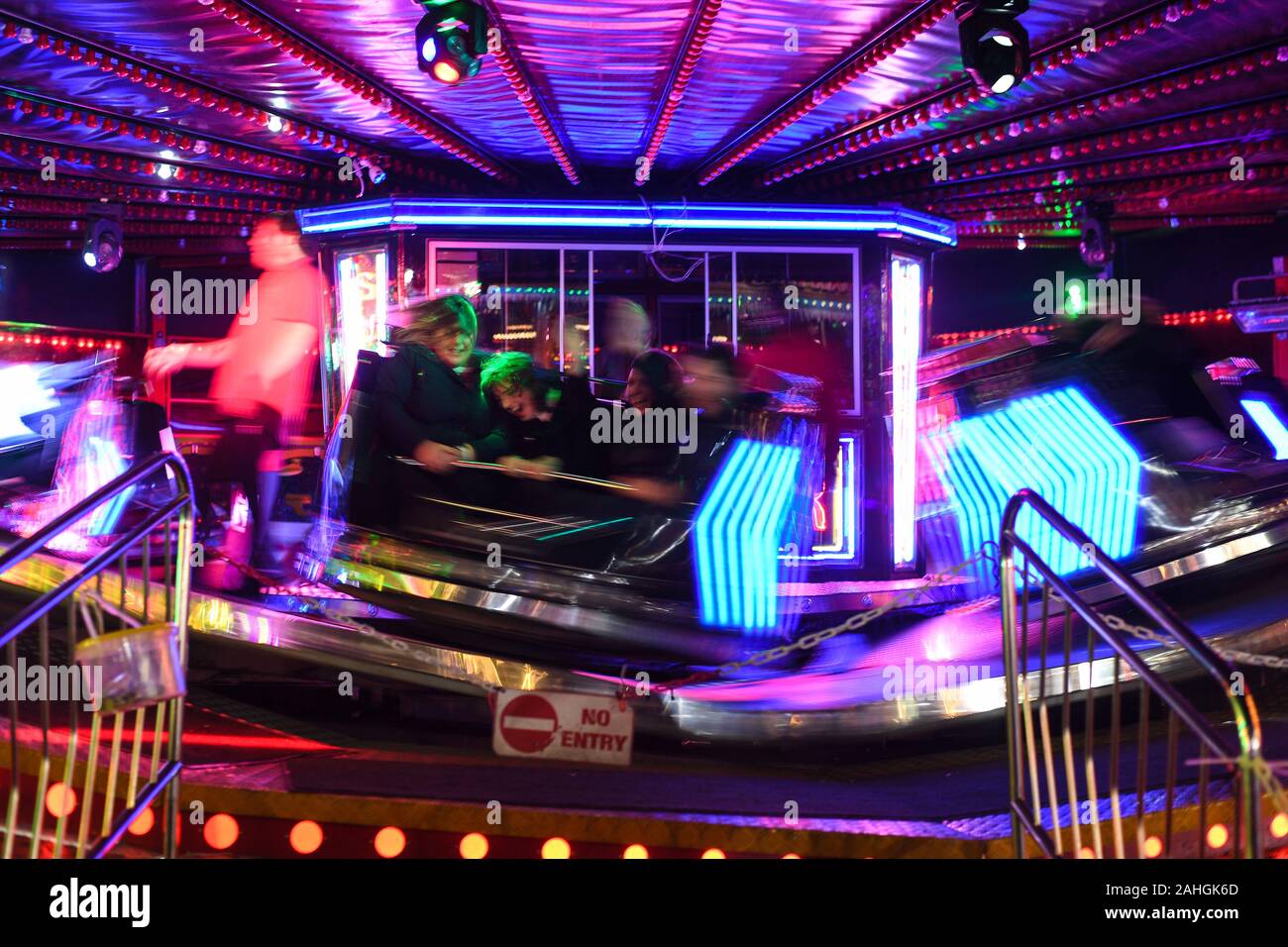 Visitors enjoy the rides at Winter Wonderland in Hyde Park, London ...