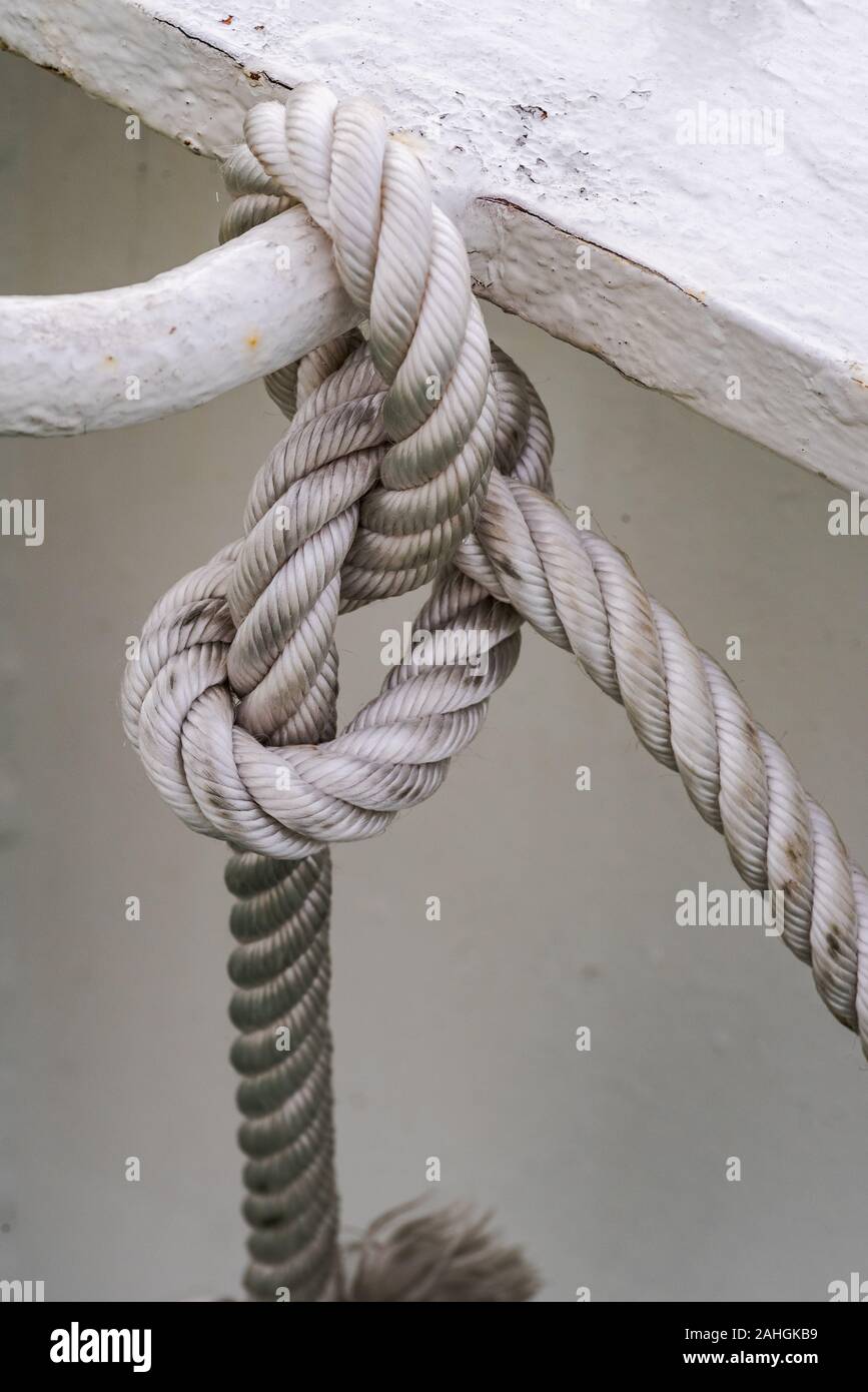 sailor knot made with thick white rope Stock Photo - Alamy