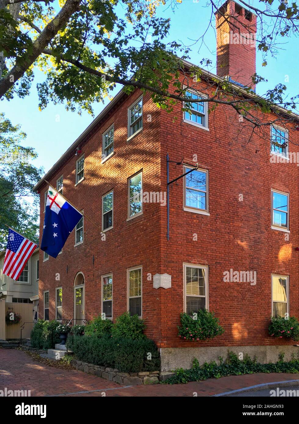 Side view of a beautiful New England three-story brick home built in ...