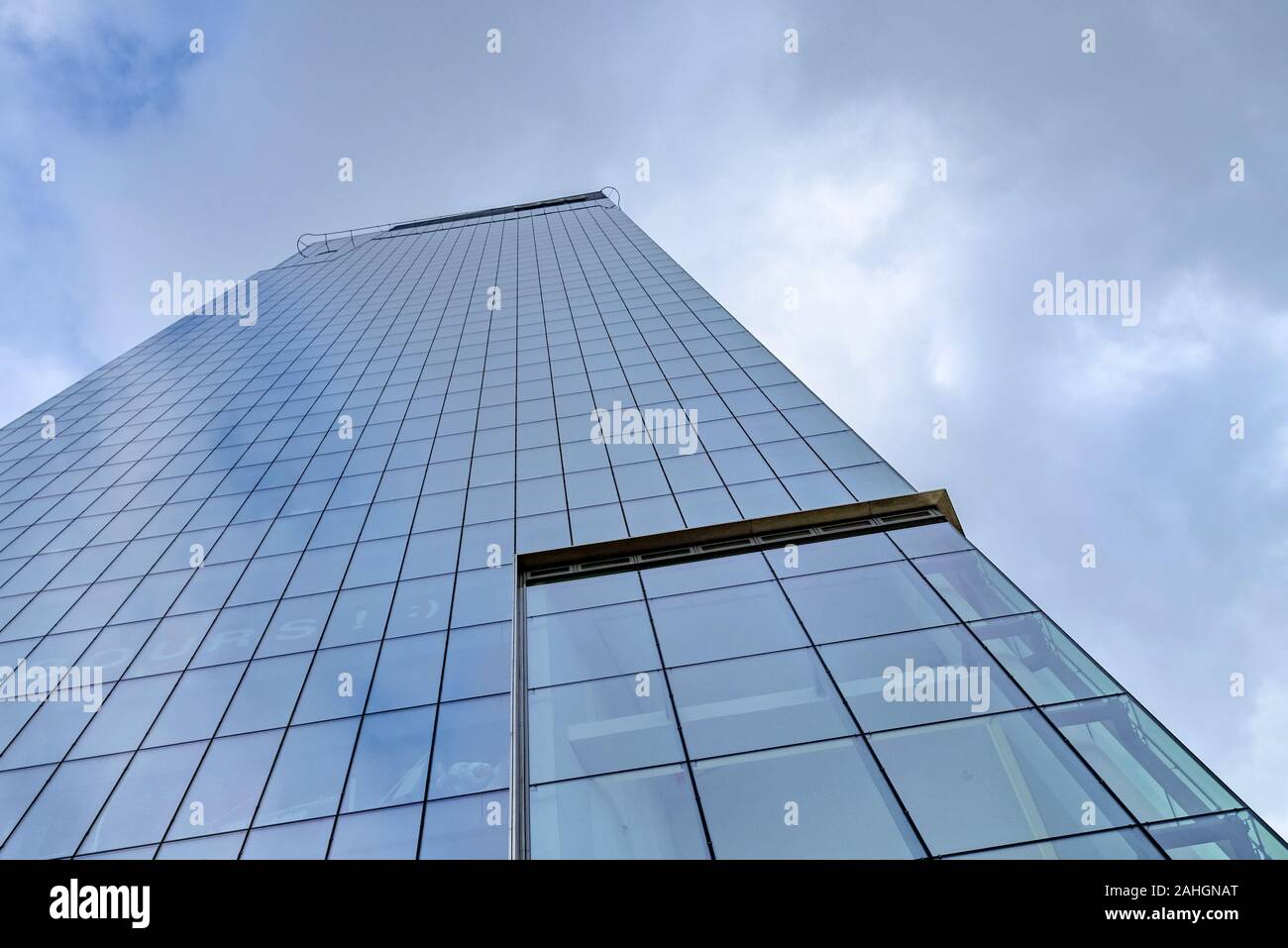 Glass skyscrapers of irregular shape. Bottom view. Abstract ...