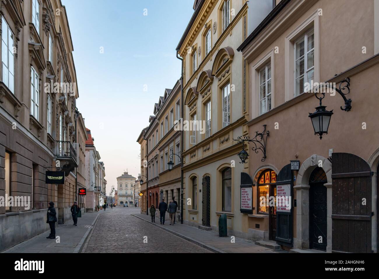 City street of old town in Warsaw. Narrow street between colorful ...