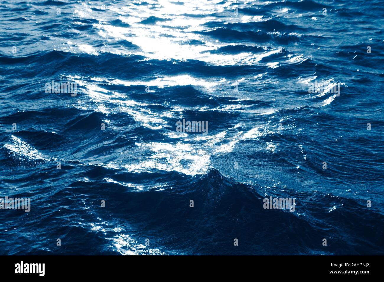 Color trend 2020. Surface of sea water colored by sunset light Stock ...