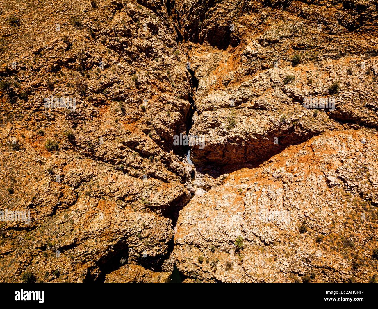 The dramatic crevice in the rock at Redbank Gorge contains a permanent ...