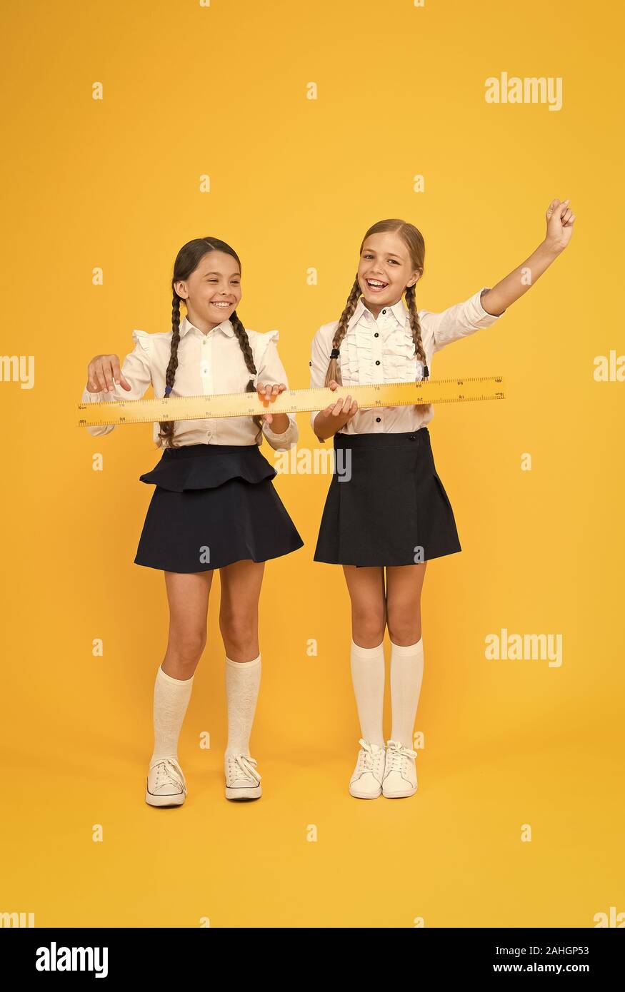 Confident pupils. happy small girls study mathematics. students use ...