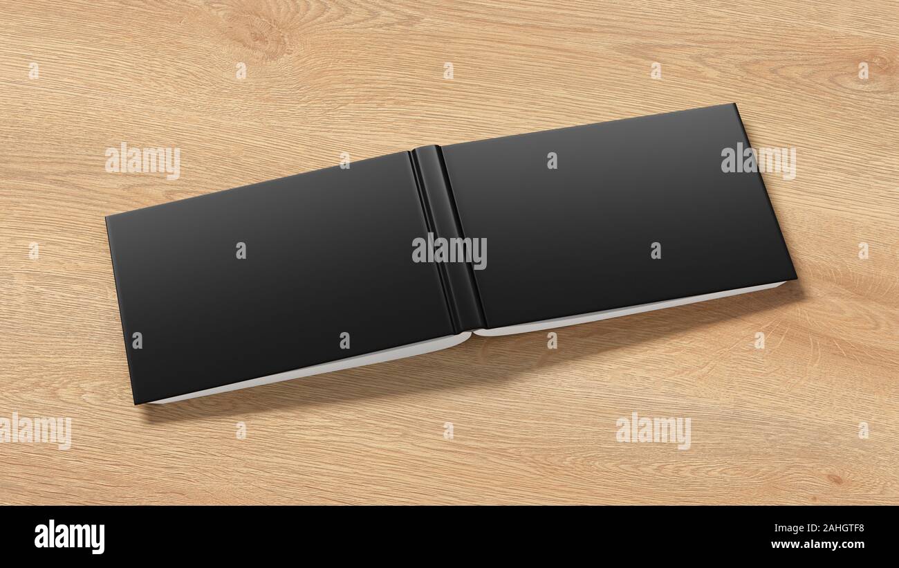 Blank black horizontal open and upside down book cover on wooden ...