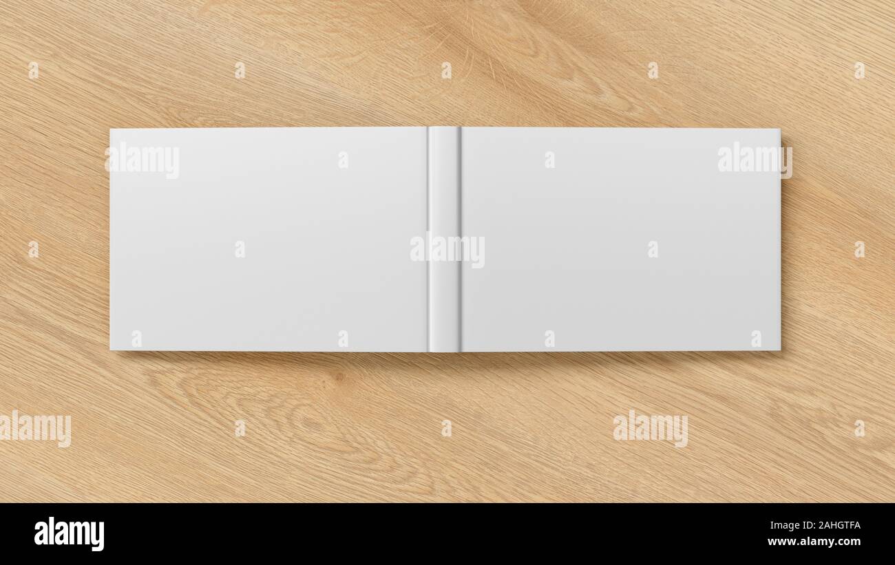 Blank white horizontal open and upside down book cover on wooden ...