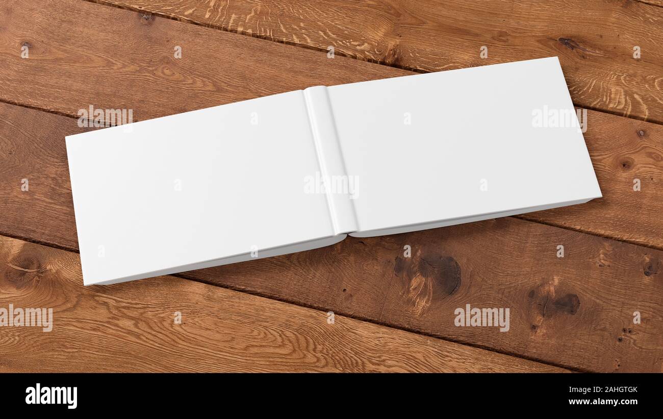 Blank white horizontal open and upside down book cover on wooden boards ...