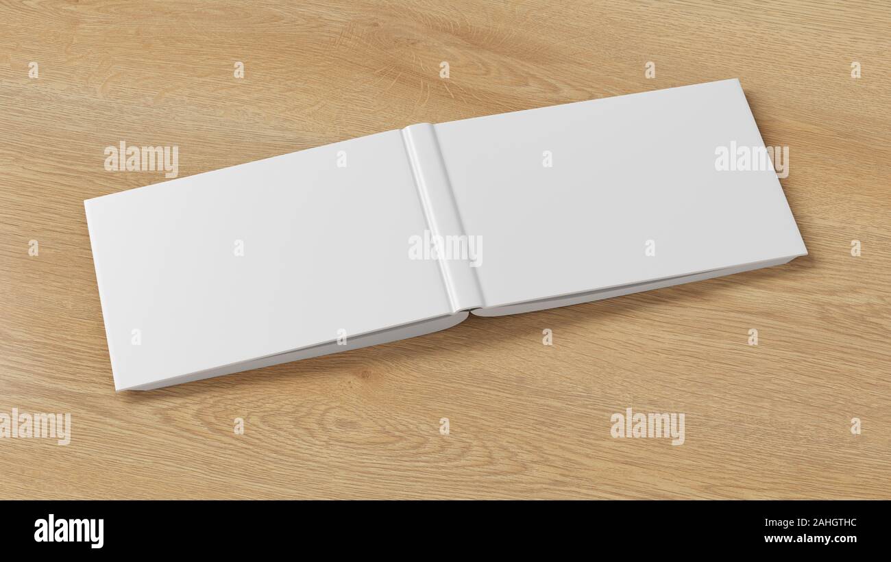 Blank white horizontal open and upside down book cover on wooden ...