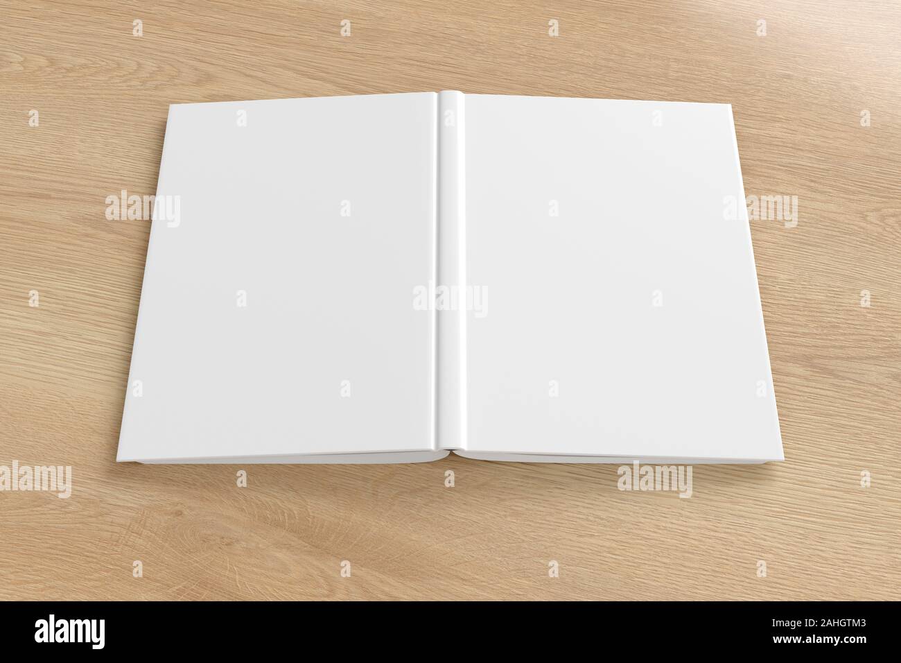 Blank white vertical open and upside down book cover on wooden ...