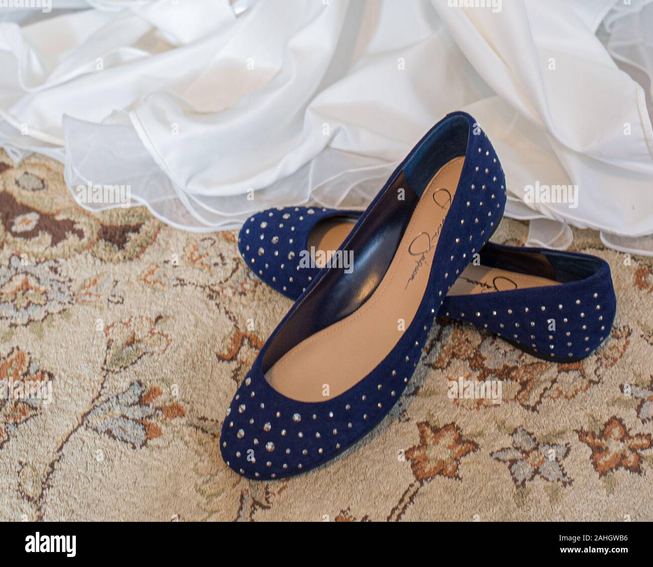 Two blue shoes worn by the bride Stock Photo - Alamy