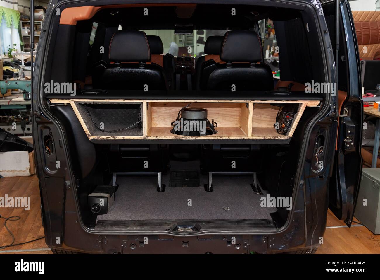 A box made of wood and sawn holes with black leather for the ...