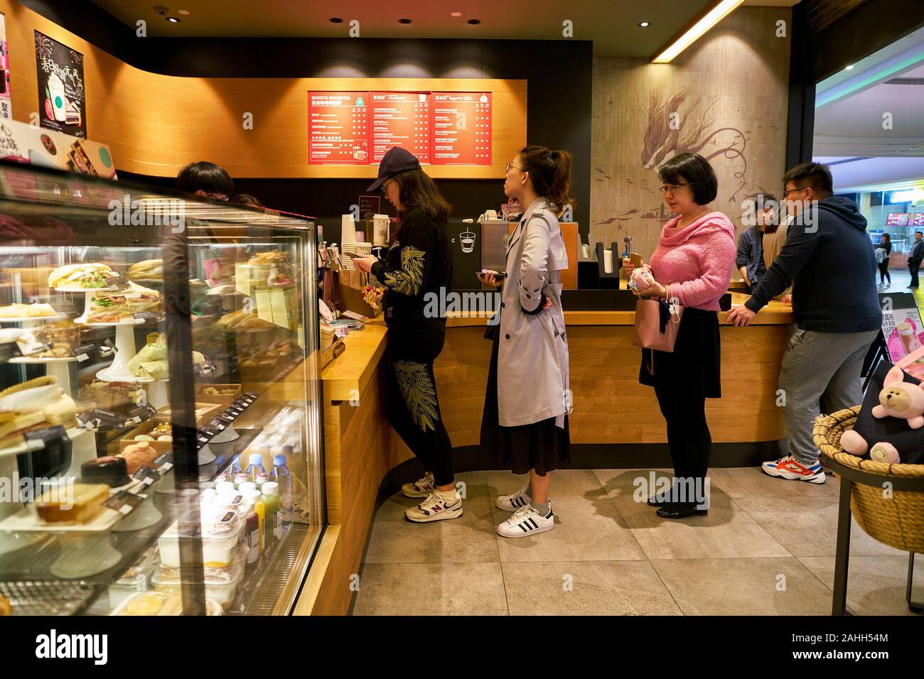 SHENZHEN, CHINA - CIRCA FEBRUARY, 2019: people are standing in line at ...