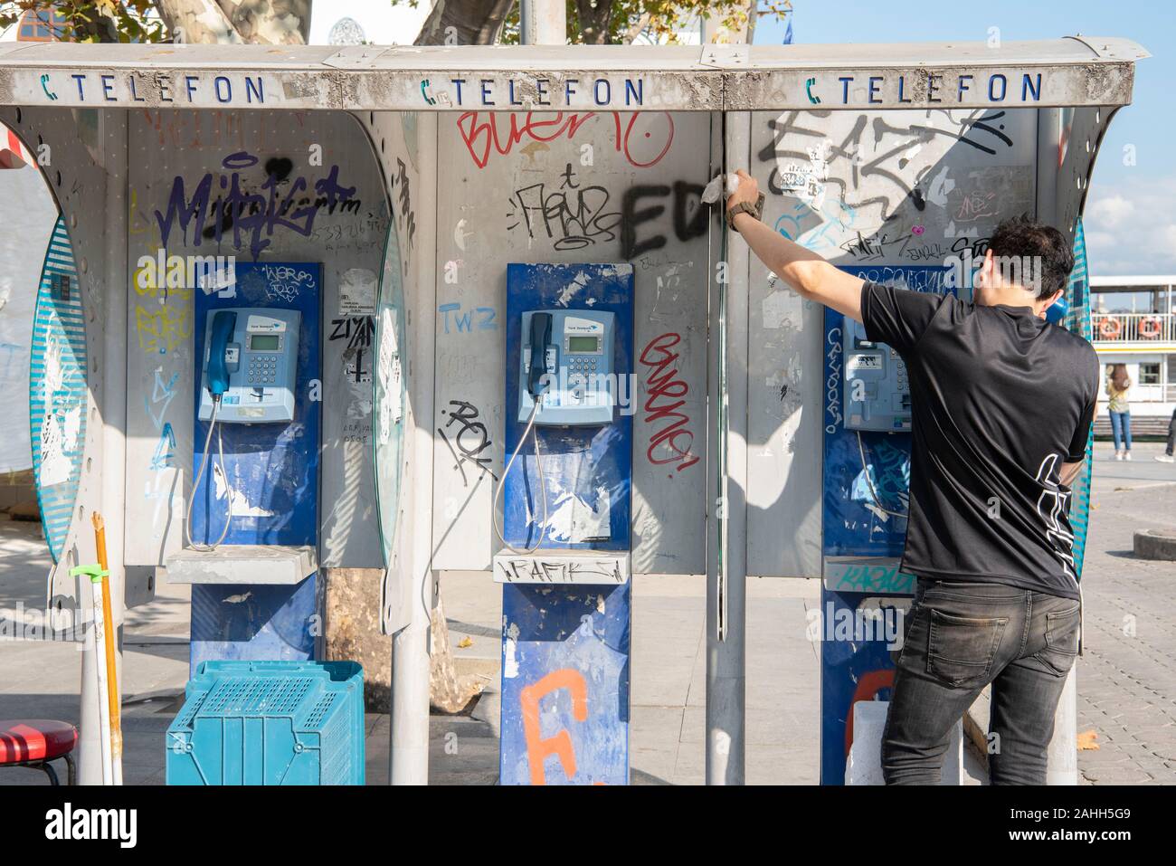 A Young Man Using Public phone Both in Street Stock Photo - Alamy