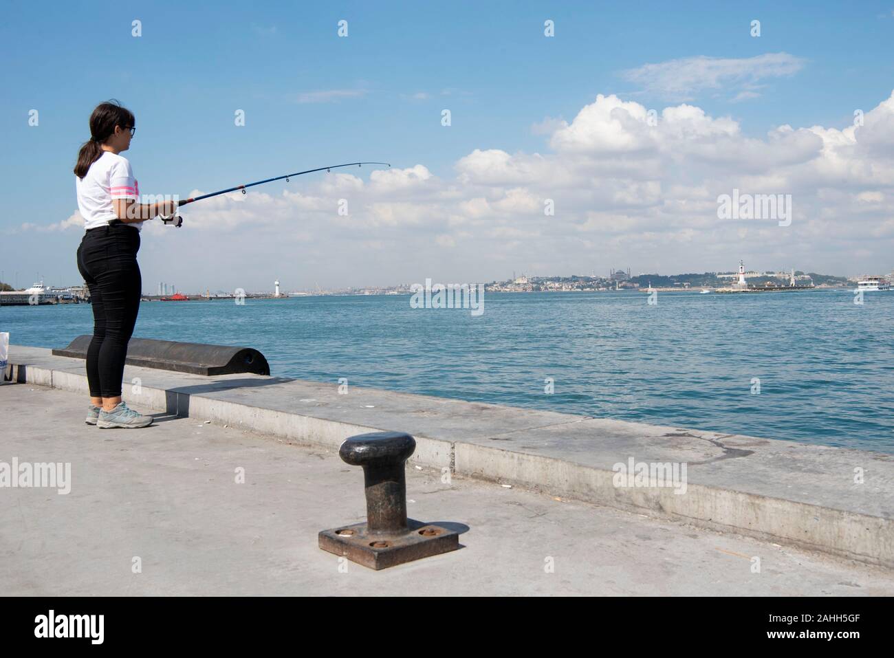 Girl with fish hi-res stock photography and images - Alamy