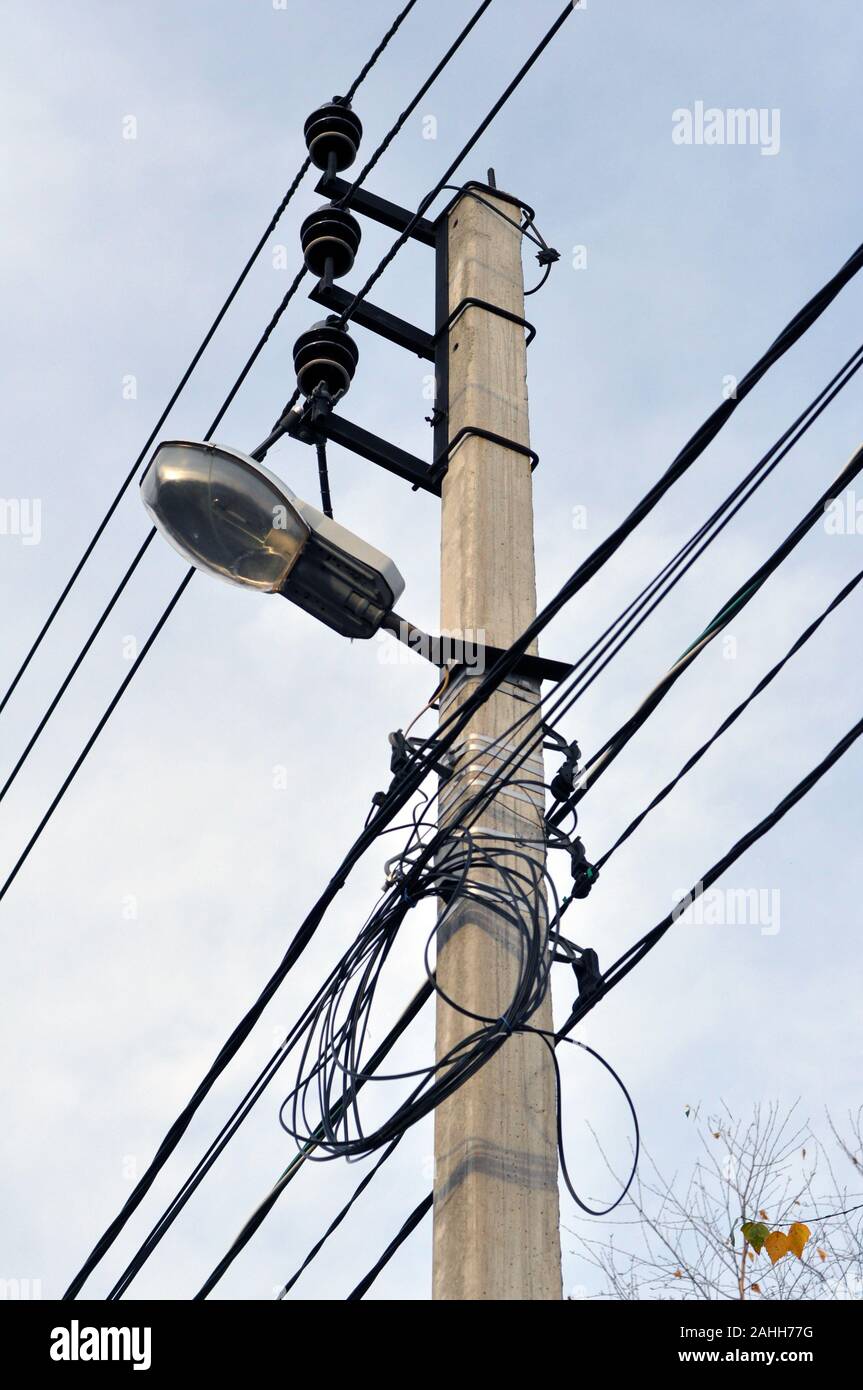 Street lighting pole with lamp and wires against the sky Stock Photo ...