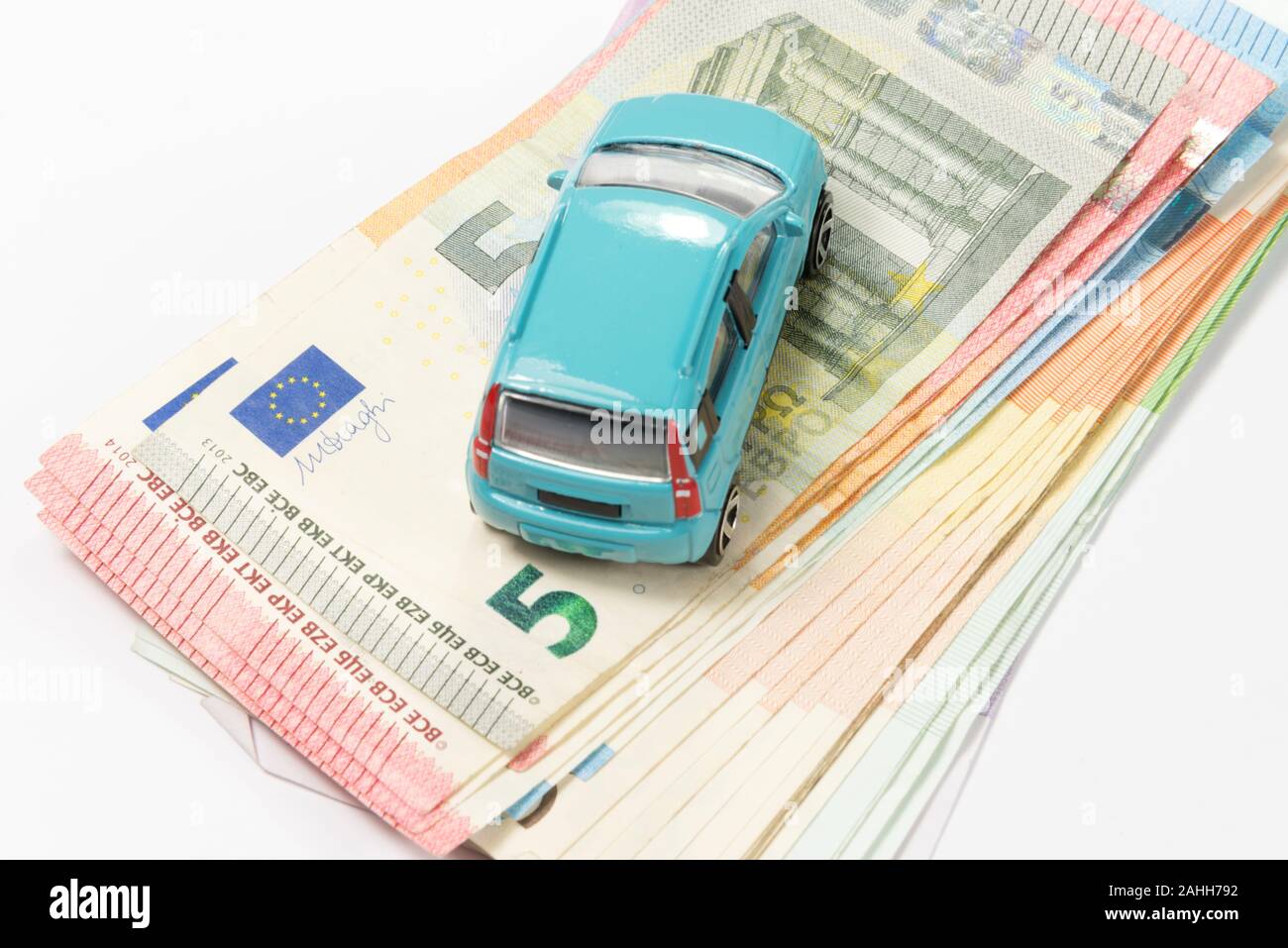 Euro banknotes and a car Stock Photo - Alamy