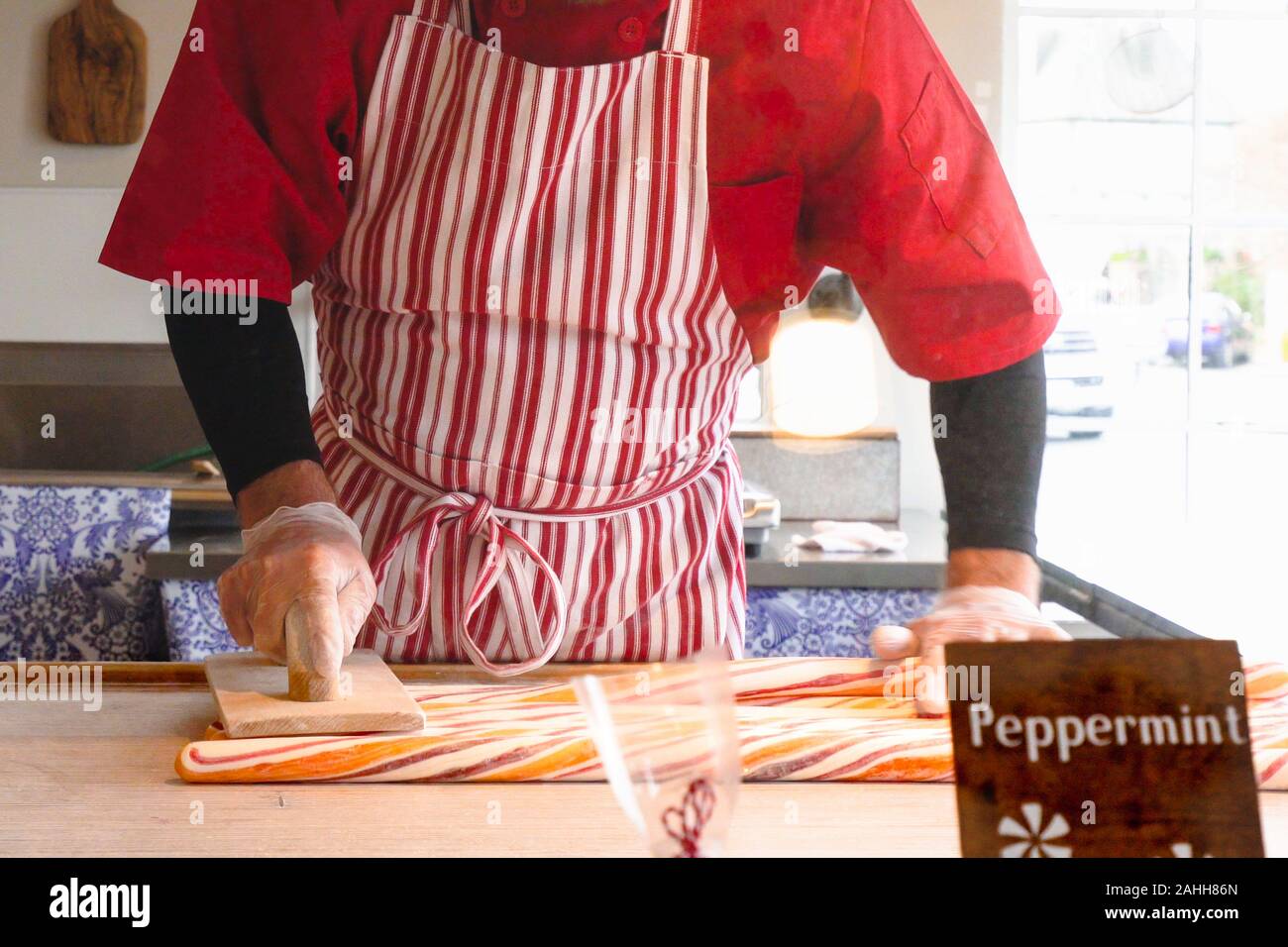 Peppermint candy. Chef making traditional holiday peppermint candies ...