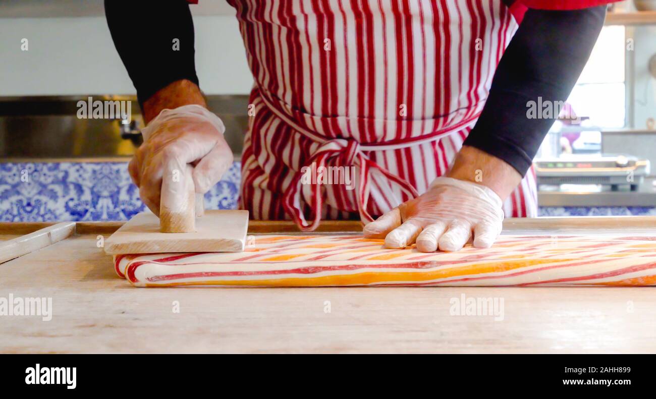 Peppermint candy. Chef making traditional holiday peppermint candies ...