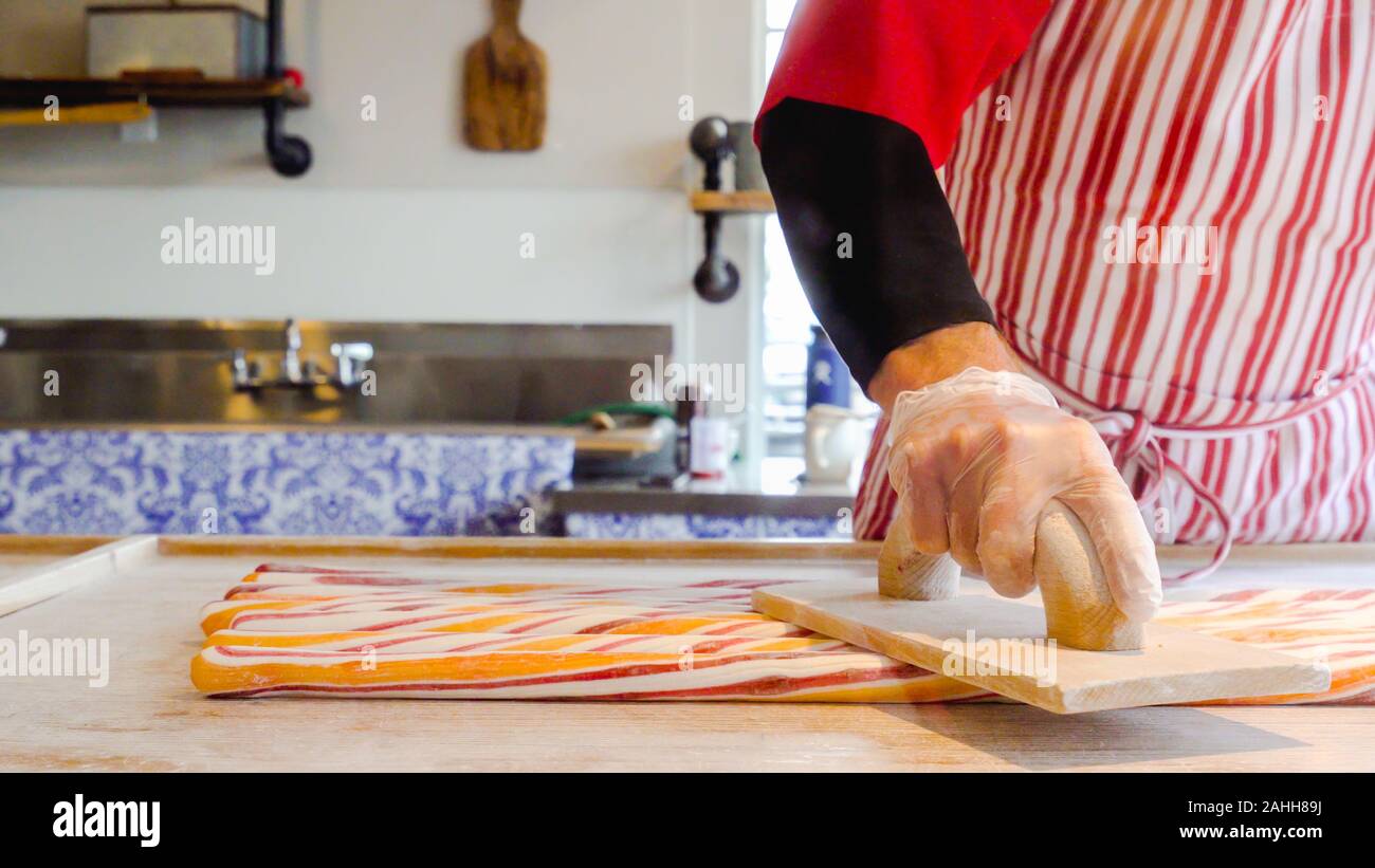 Peppermint candy. Chef making traditional holiday peppermint candies ...