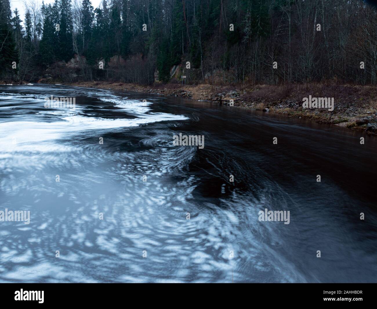 abstract blurry water texture, a steep river in the evening chair ...