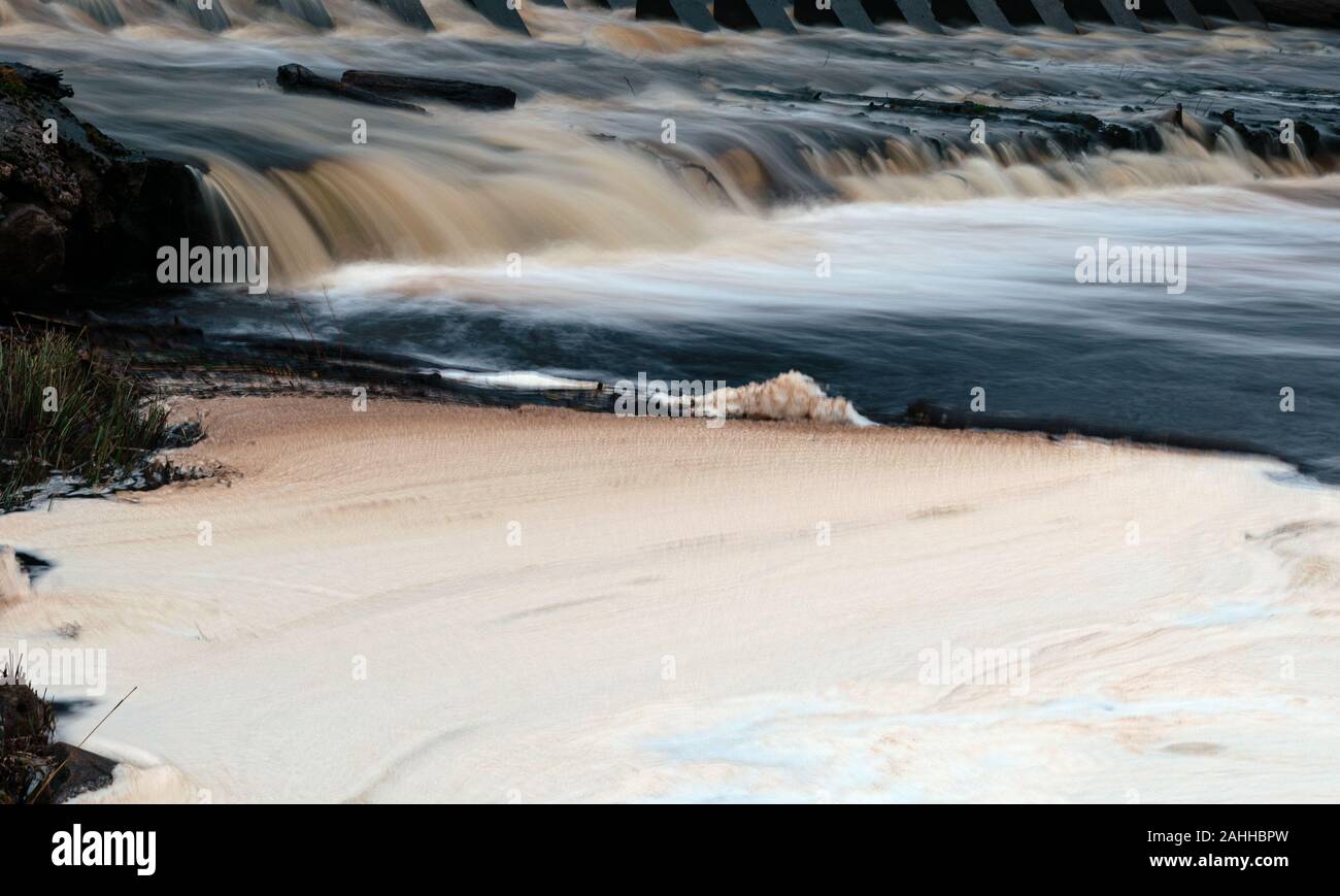 abstract blurry water texture, a steep river in the evening chair ...