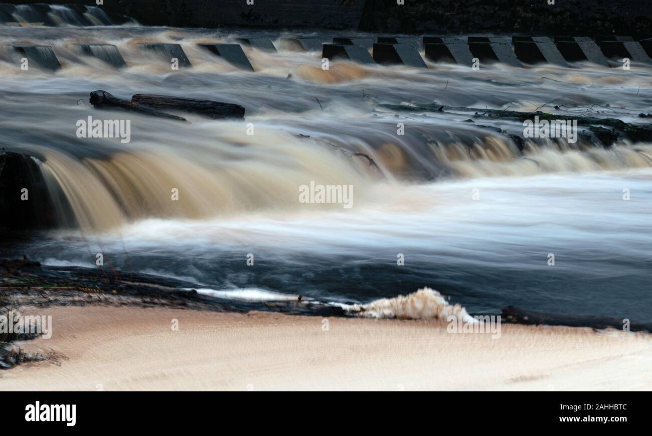 abstract blurry water texture, a steep river in the evening chair ...
