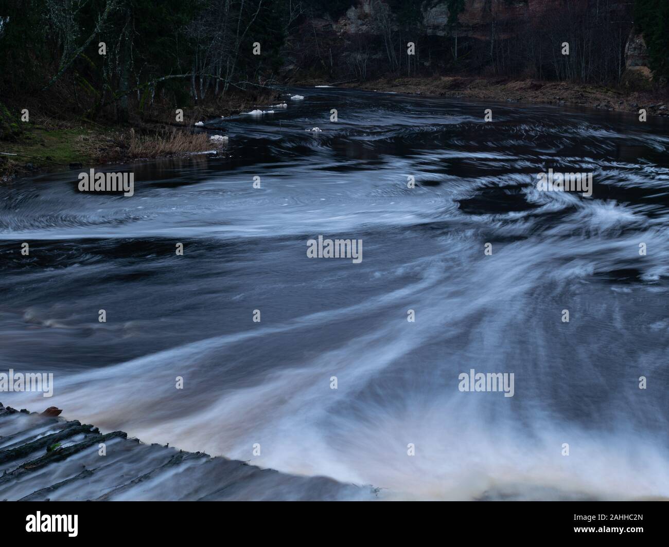 abstract blurry water texture, a steep river in the evening chair ...