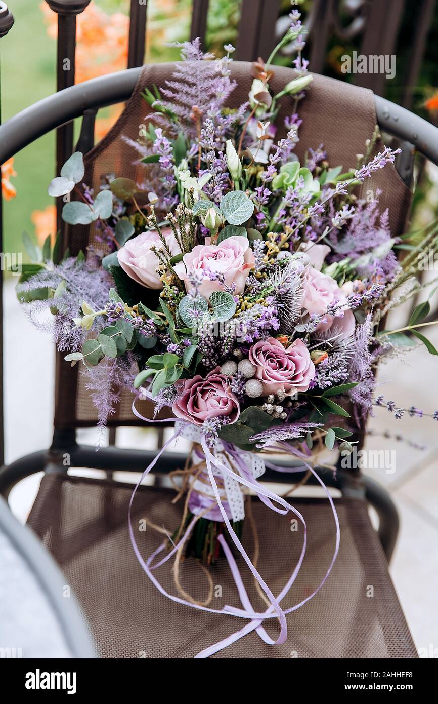 Wedding bouquet decorated with lavender flowers. A solemn event Stock ...