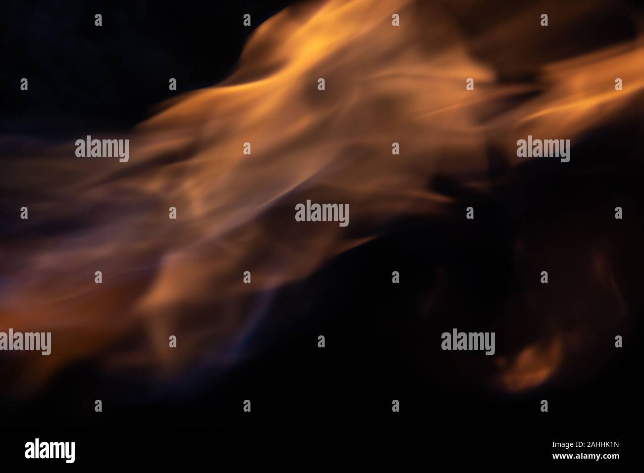 Soft blur flame from moving to the top with some blue flame on black ...