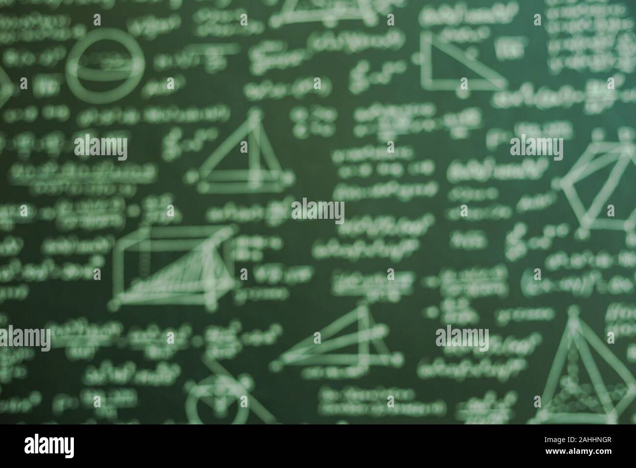 a bit blur Math on dark green board with many solution Stock Photo - Alamy
