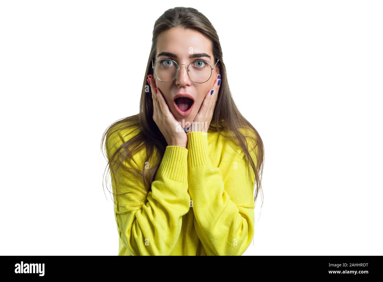 Young surprised woman in glasses yellow clothes on white isolated ...
