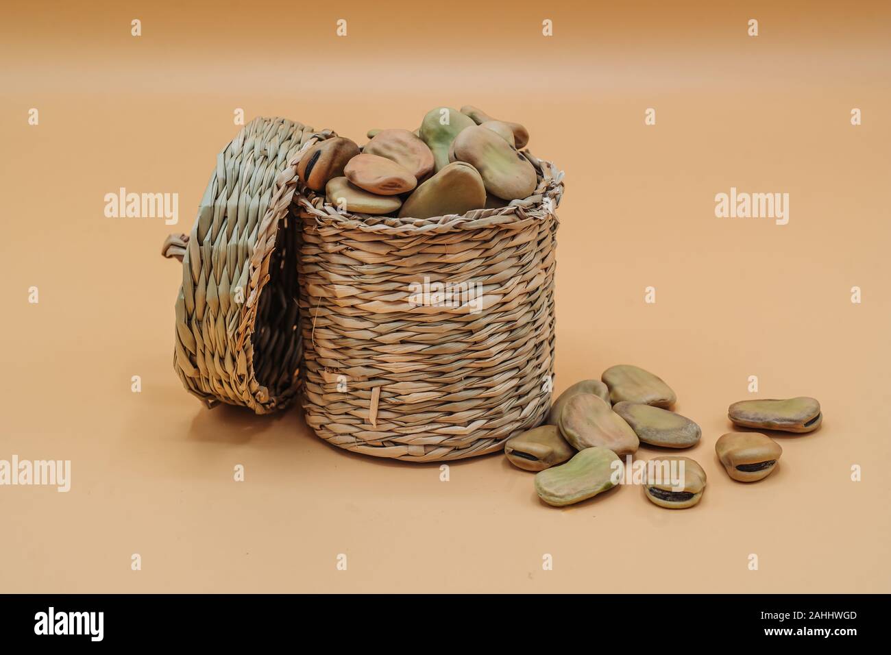 Healthy organic dried broad beans in a straw basket Stock Photo - Alamy