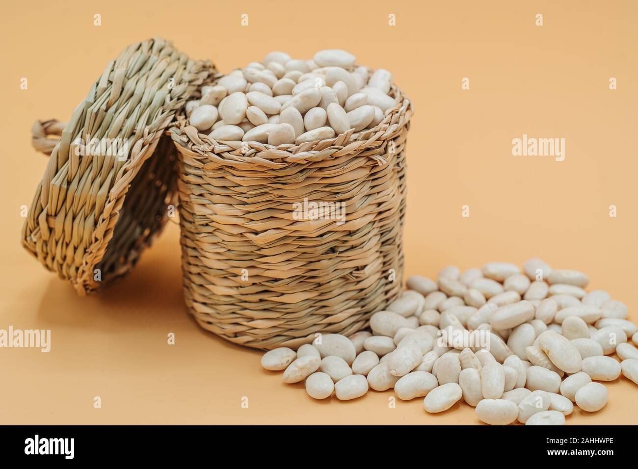 Healthy organic dried white beans in a straw basket Stock Photo - Alamy