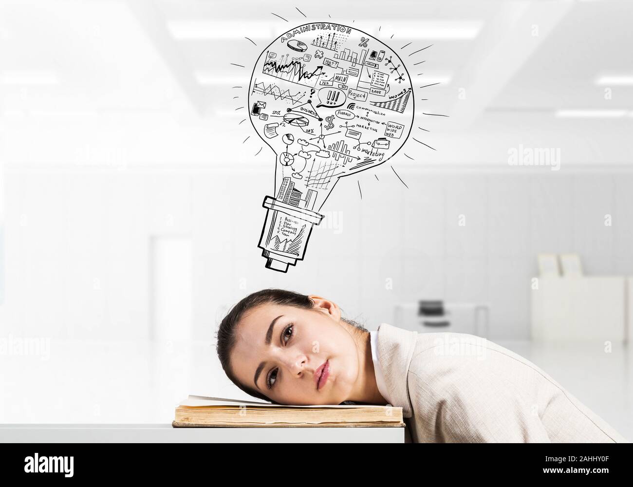 Bored business woman lying on desk with open book. Young tired student ...