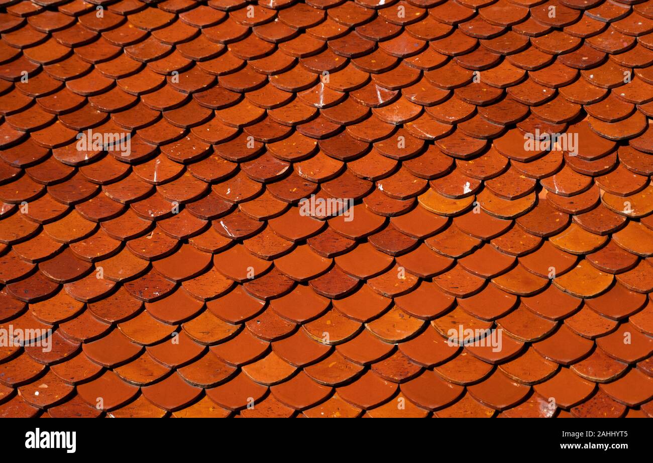 Natural orange roof tiles on a building as a texture Stock Photo - Alamy