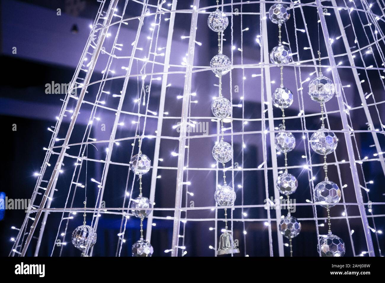 white soft light LED on Christmas tree skeletal with small disco ball ...