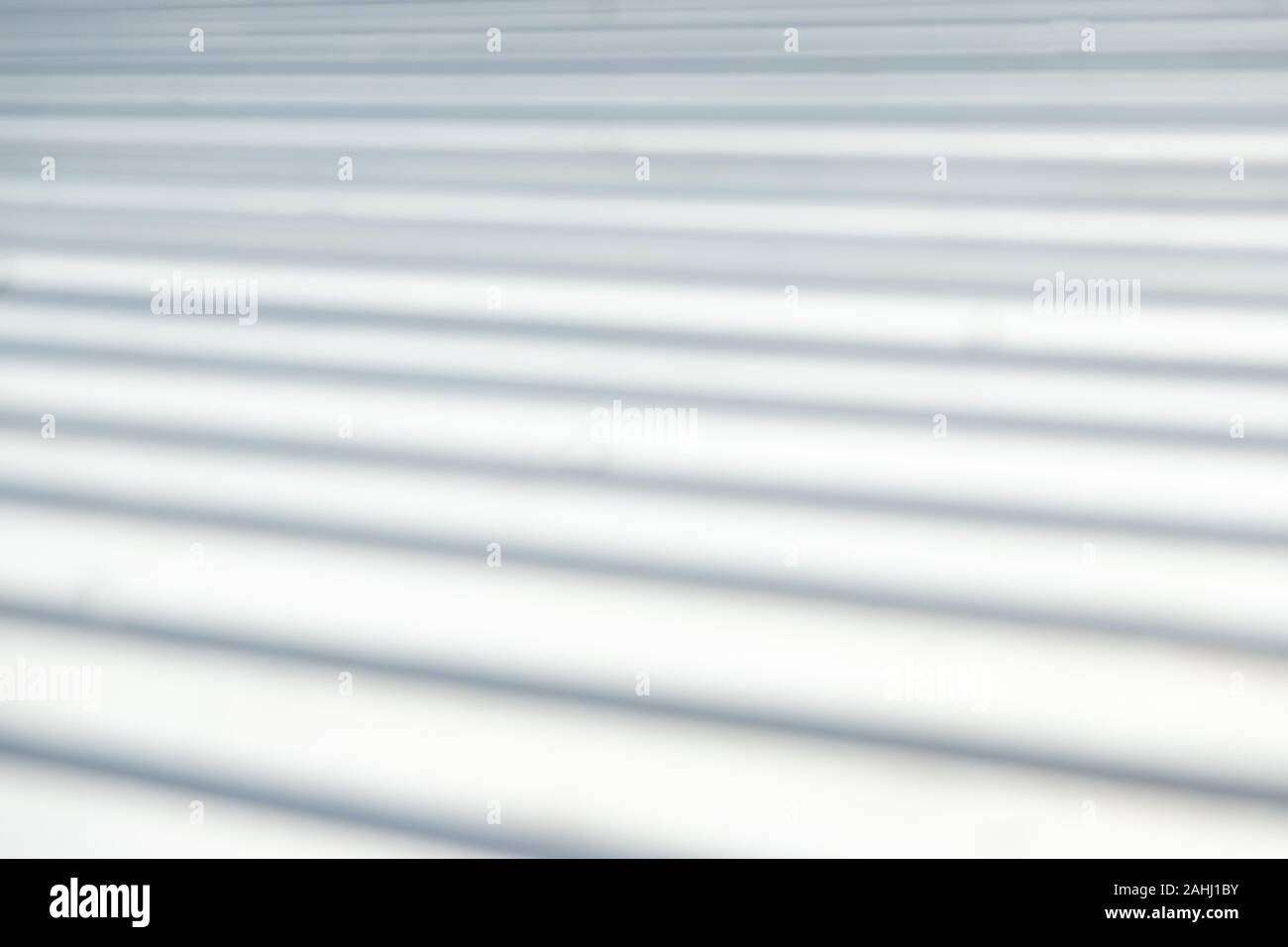 blur white and clean metalic roof pattern in day time Stock Photo - Alamy