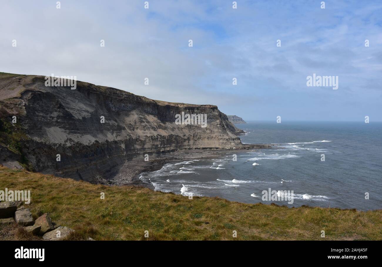 Rocking waves rolling ashore in Robin Hood's Bay Stock Photo - Alamy
